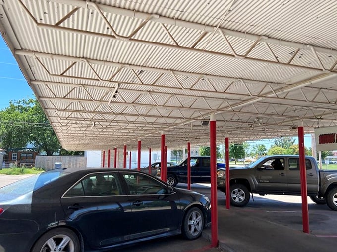 The classic drive-in canopy still stands, ready to shelter hungry visitors from Kansas sun or rain. Some traditions are worth preserving.
