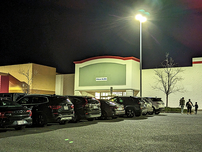 Even the parking lot fills with strategic shoppers plotting their bin-diving techniques before the doors open to this temple of discounts.