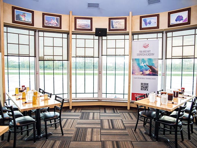 These window seats offer the perfect vantage point for watching actual planes while enjoying your meal—meta dining at its finest.