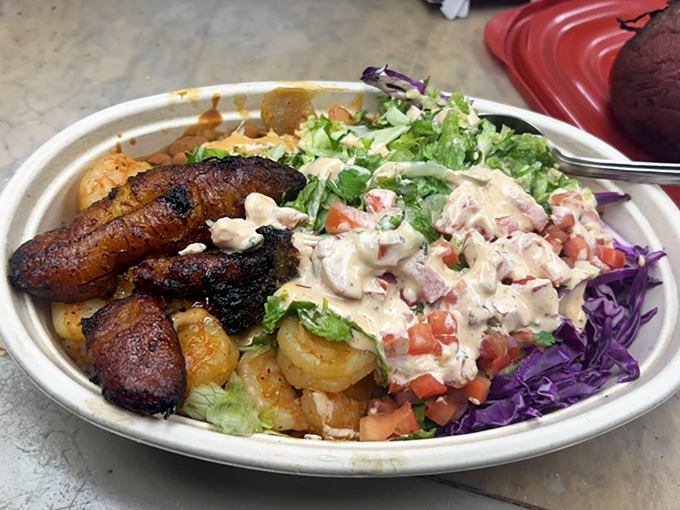 Blackened plantains and succulent shrimp share real estate in this colorful bowl – a coastal vacation that fits perfectly in a biodegradable container.