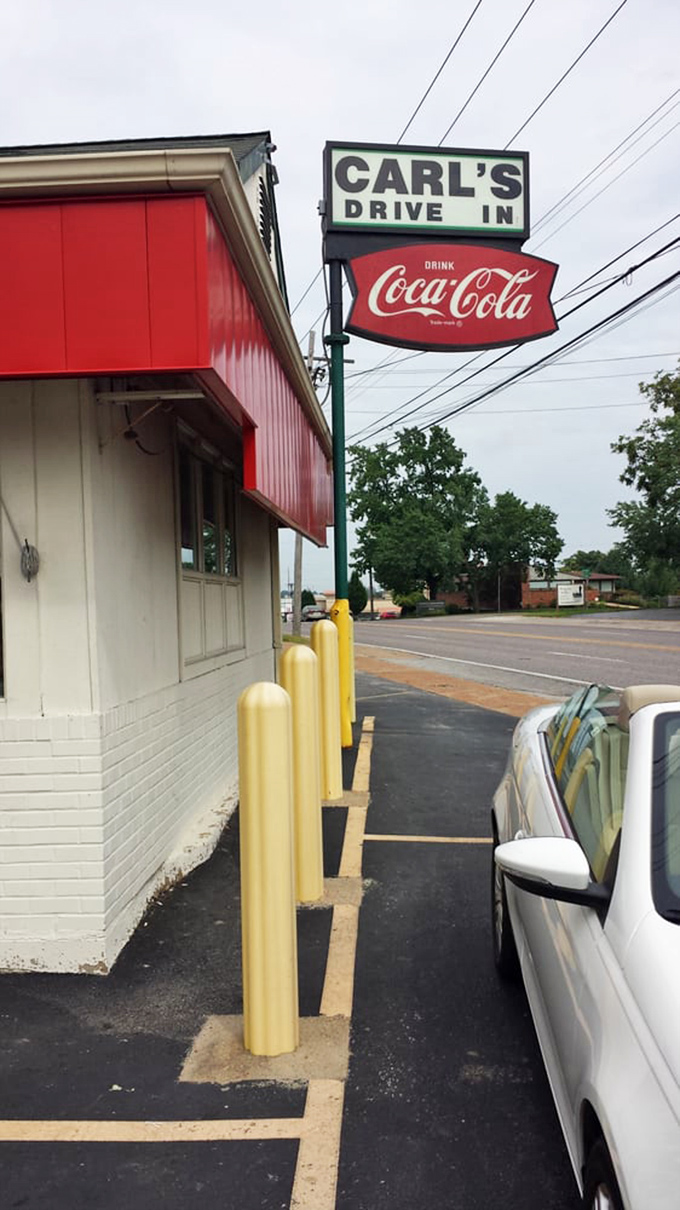 The iconic sign has directed hungry travelers for decades, a beacon of burger hope on Manchester Road's commercial corridor.