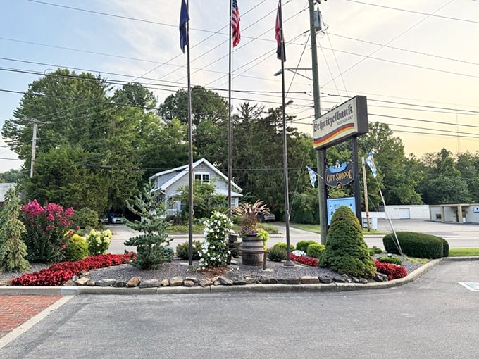 The entrance garden and sign stand like sentinels, promising authentic German flavors that have kept Hoosiers coming back for generations.