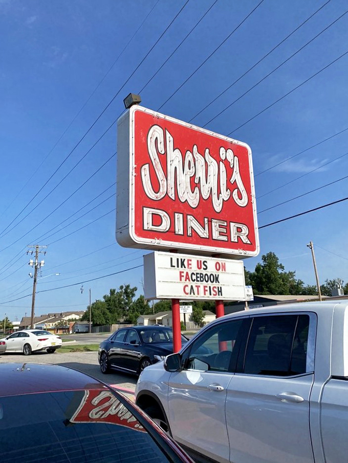 The sign stands proud against the Oklahoma sky, a neon promise that inside awaits the kind of meal that makes detours worthwhile.