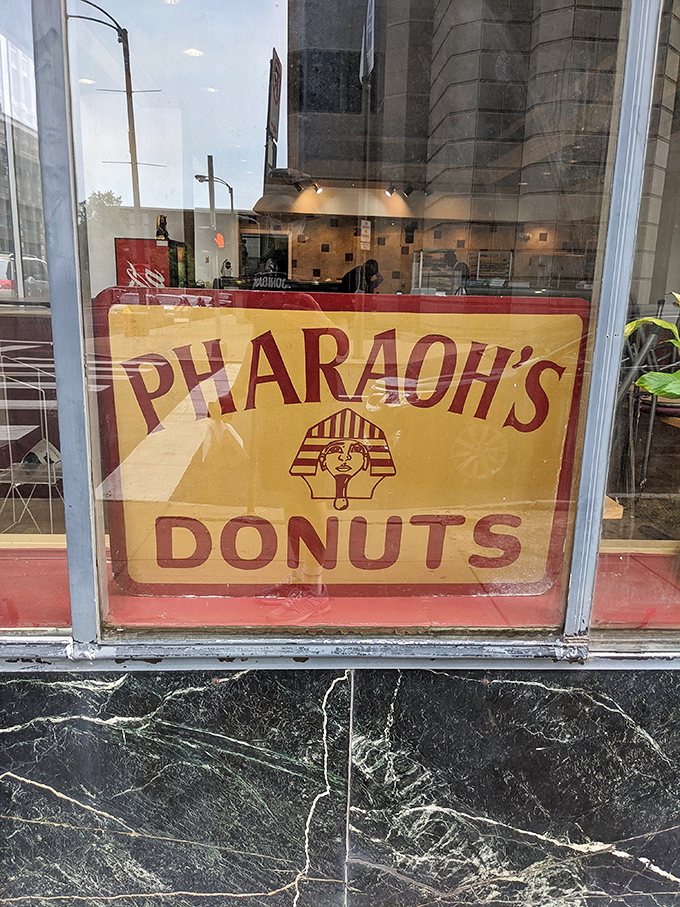 The sign that's launched countless early-morning pilgrimages, with its vintage aesthetic promising the sweet taste of royalty within these hallowed walls.