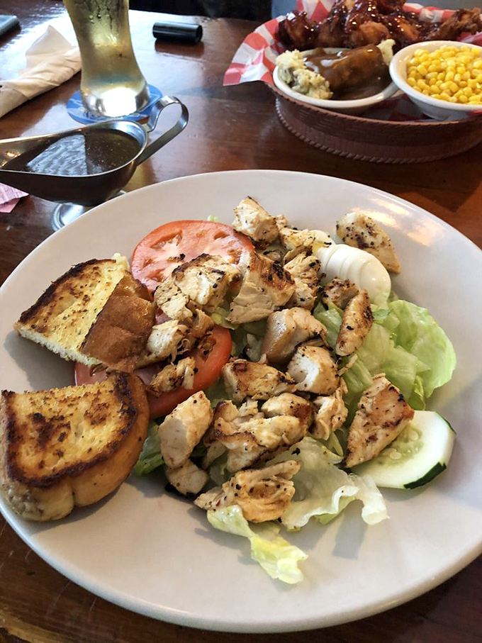 Fresh, vibrant, and surprisingly light&mdash;this grilled chicken salad proves The Wooden Barrel knows its way around the garden as well as the fryer.