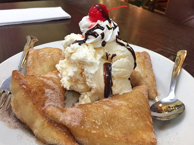 Sopapillas with ice cream and chocolate sauce&mdash;proof that dessert knows no borders. Those pillowy fried triangles are what happy endings are made of.