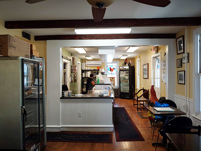 The dining area's warm woods and yellow walls create that "grandma's kitchen" vibe where calories somehow don't count and seconds are mandatory.