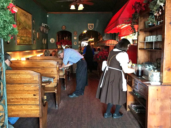 Traditional dress hints at Old World authenticity &ndash; these folks aren't just serving food, they're preserving cultural heritage one schnitzel at a time.