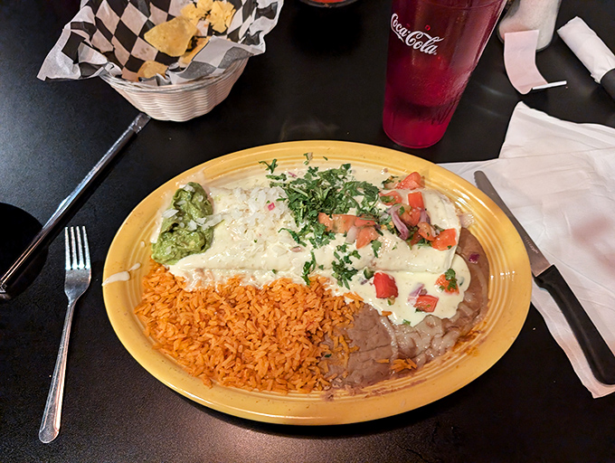 The burrito blanquito&mdash;cheese-covered, cilantro-flecked, and accompanied by the classic trio of rice, beans, and guacamole. A study in simple perfection on a sunny yellow plate.