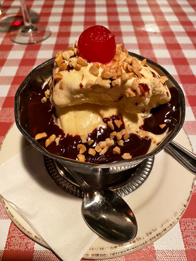 Ice cream sundae with that maraschino cherry on top&mdash;proof that even steakhouse desserts understand the importance of a good hat.