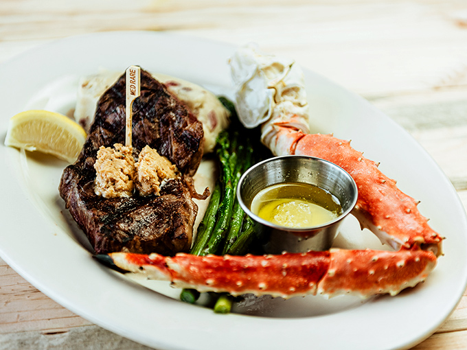 The ultimate land-meets-sea alliance: a perfectly seared steak alongside king crab legs that would make Neptune himself jealous.