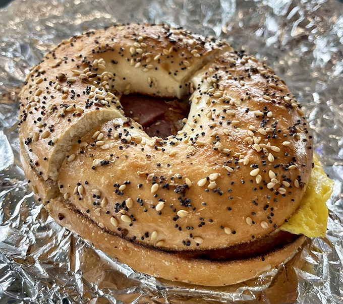 Whitney Donut's storefront against Connecticut's blue sky - a beacon of hope for the hungry and caffeine-deprived. 