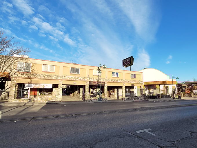 Morning light bathes these stone-fronted shops in golden warmth, inviting early birds to start their treasure hunting adventures.