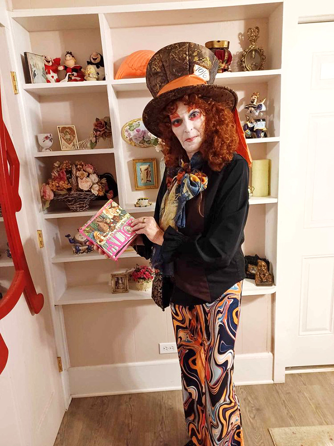 The Mad Hatter himself would approve of this colorful character bringing theatrical flair to tea time. When your server is this committed, you know you're somewhere special.