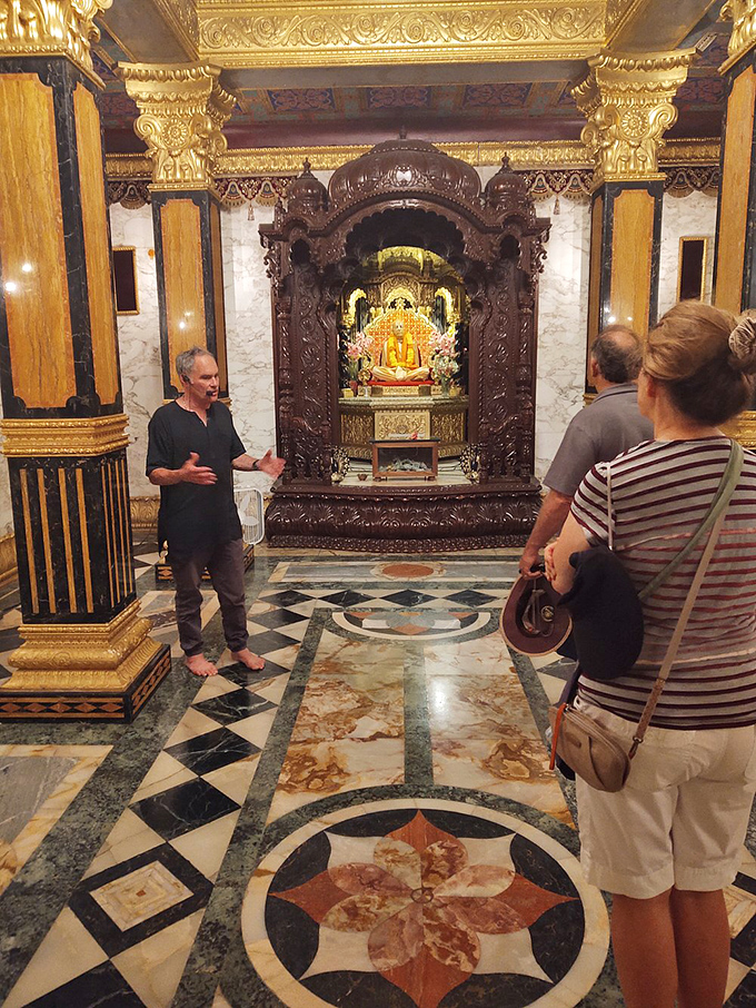 A tour guide shares stories that bring the intricate shrine to life. Sometimes the best part of visiting is hearing the tales behind the gold.