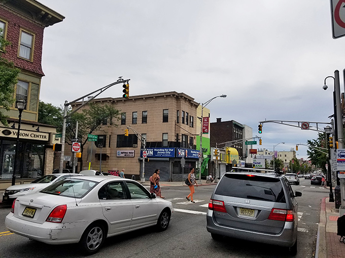 Urban life flows around the discount oasis, with Jersey City streets providing the perfect backdrop for post-shopping adventures.