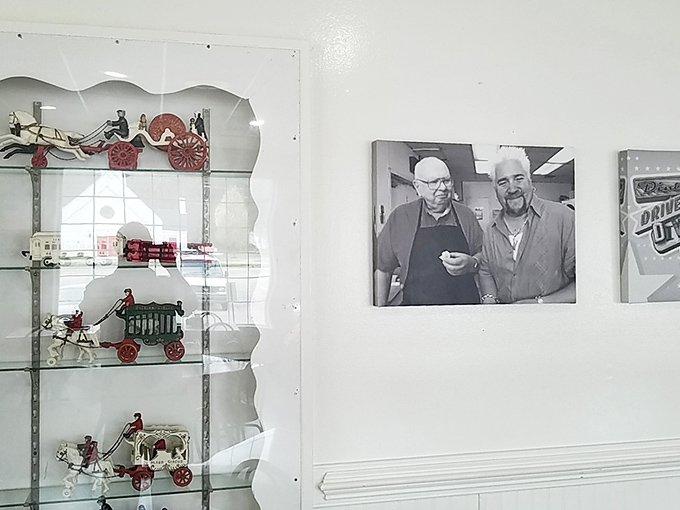 The wall display honors the diner's history while miniature horse-drawn carriages remind visitors of simpler times&mdash;when calories weren't counted, just thoroughly enjoyed.