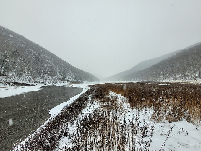 Winter's icy grip transforms the reservoir into a monochromatic masterpiece. Mother Nature's black and white photography puts filters to shame.