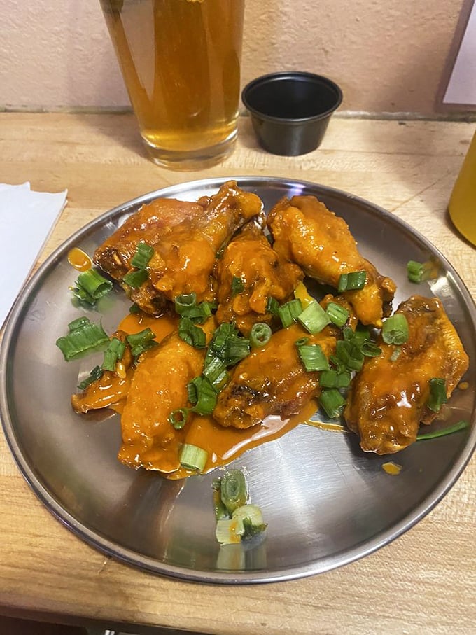 Wing perfection achieved! These buffalo beauties, garnished with green onions, prove Beefy's mastery extends beyond the burger realm.