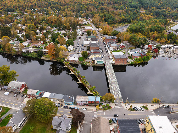 From above, Shelburne Falls reveals its perfect symmetry&mdash;a village embraced by river and forest, proving that sometimes the best town planning happens naturally.