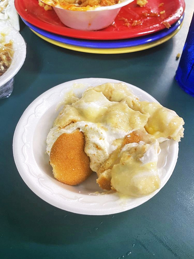 Banana pudding that transcends dessert into cultural artifact. Those vanilla wafers have soaked up just enough custard to reach nirvana.