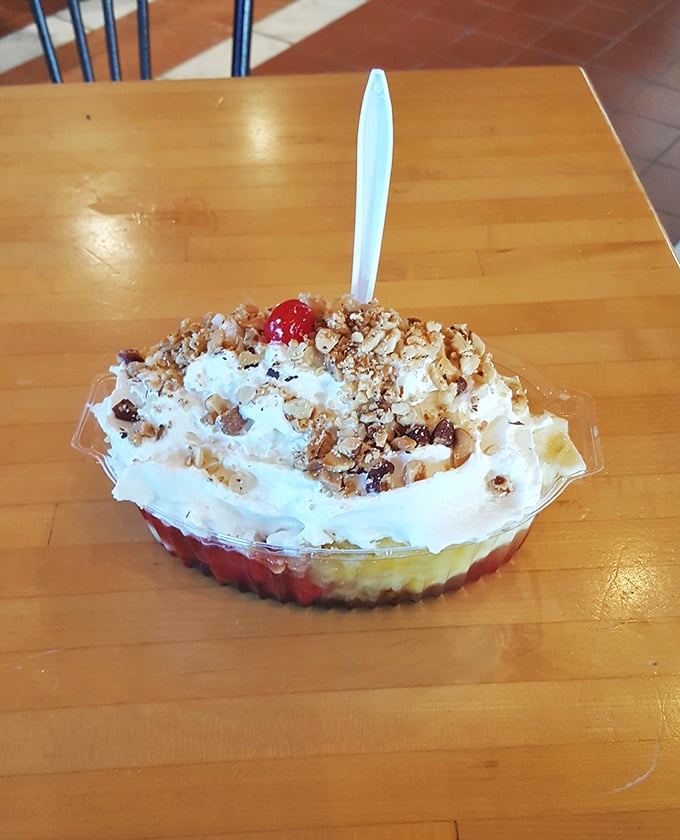 This banana split isn't just dessert; it's an architectural achievement where fruit, cream, and toppings achieve perfect structural and flavor harmony.