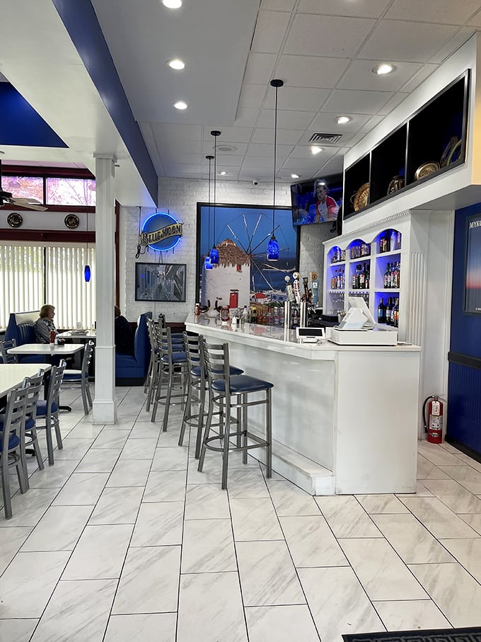 The bar area gleams with blue and white brilliance, like a little slice of Santorini tucked into Concord, complete with ouzo possibilities.