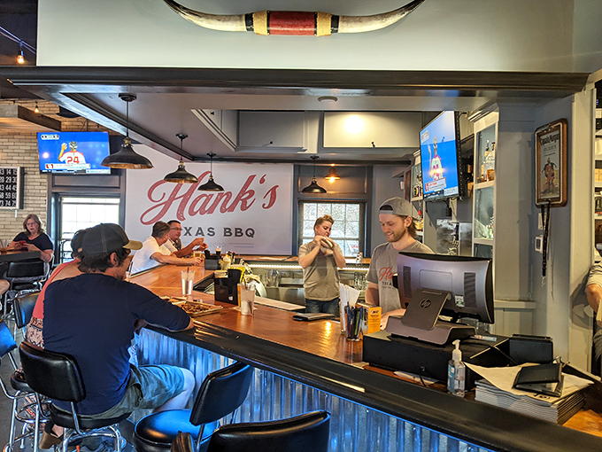 The bar at Hank's&mdash;where strangers become friends over bourbon and brisket discussions that could last until closing time.