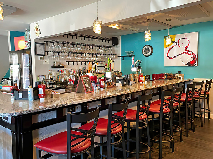 The welcoming bar area where coffee flows freely and breakfast conversations turn strangers into temporary best friends.