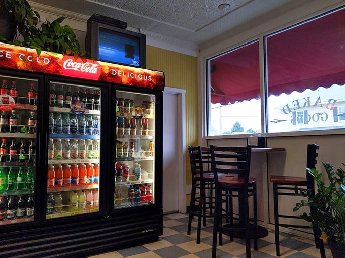 The beverage shrine illuminates the dining area with its colorful glow. Choosing your drink here feels like an important life decision, not just a meal addition.
