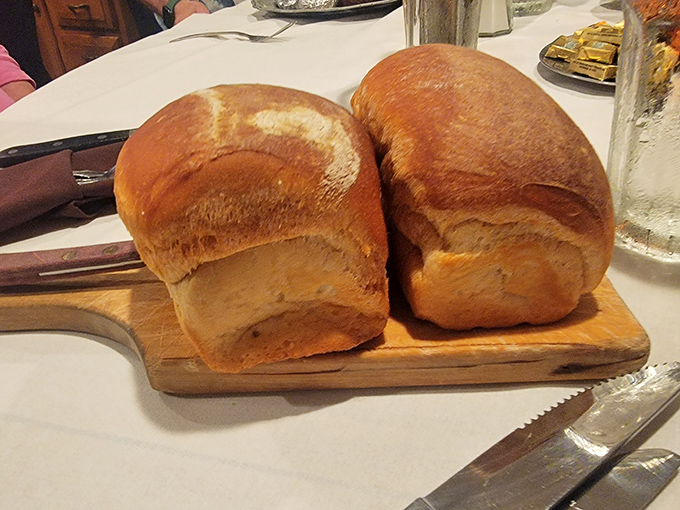 Homemade bread that arrives warm, with a crackling crust and pillowy interior. The kind that makes you reconsider your carb rules before the main event even arrives.