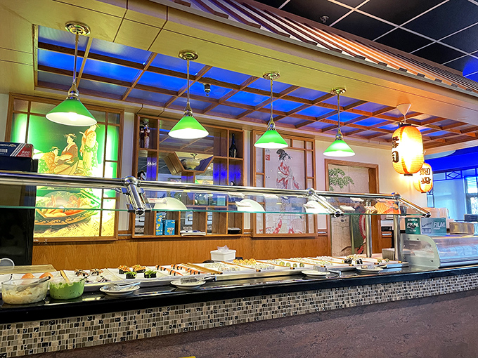 The sushi station under green pendant lights feels like its own little world. A buffet-within-a-buffet where raw delights await the adventurous.