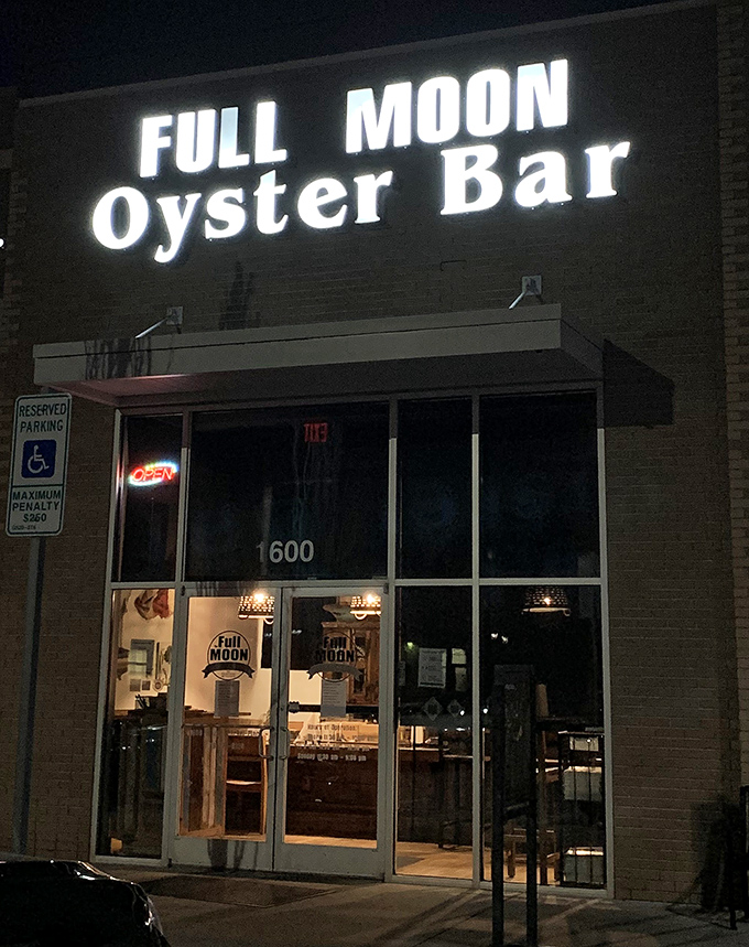 The glowing sign serves as a nighttime bat signal for seafood enthusiasts. "Quick, to the Oyster Bar! Fresh catches await!"