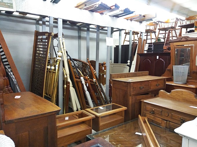 Solid wood furniture stands in dignified rows, built in an era when things were made to outlast their owners.