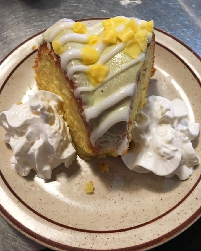 Lemon cake that makes you close your eyes when you take a bite. The whipped cream isn't decoration—it's essential to the experience.