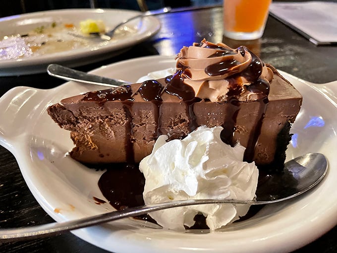 Chocolate decadence with whipped cream standing by for moral support. The kind of dessert that makes you seriously consider skipping the main course next time.
