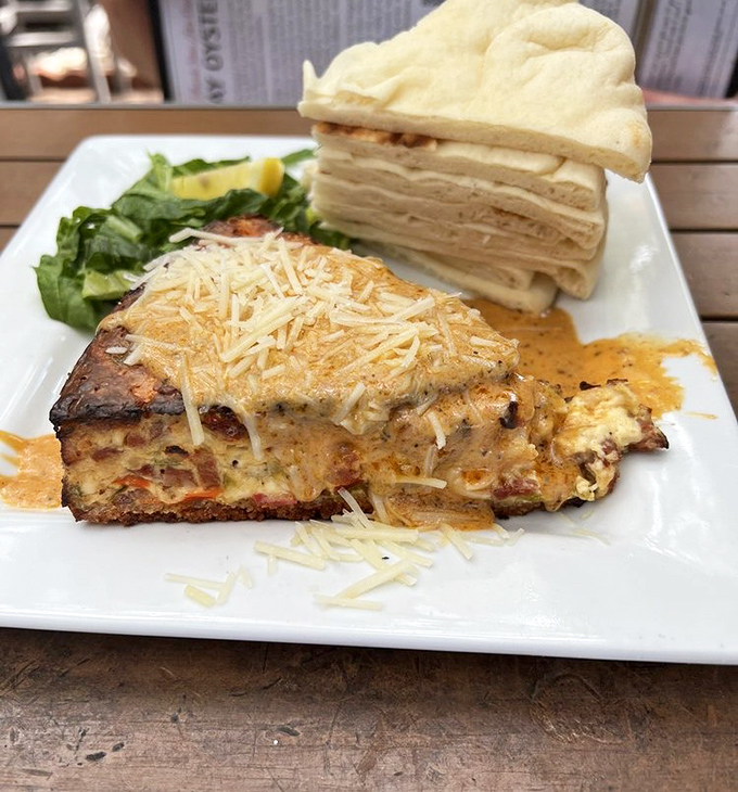 A slice that defies categorization – part savory, part dreamy, all delicious – served with the kind of presentation that says, "Yes, we take our food seriously."