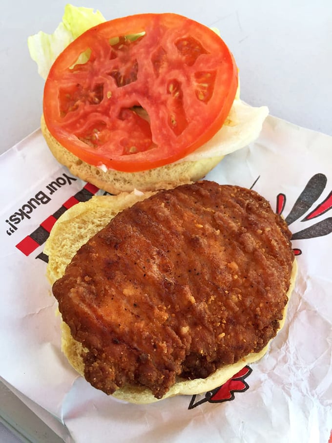 A perfectly crisp chicken sandwich awaiting its destiny. That golden-brown patty promises a satisfying crunch that will echo through your memory for days.