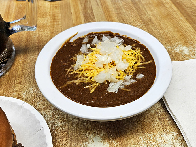 The chili arrives topped with a snowfall of onions and cheese&mdash;a hearty Missouri interpretation of comfort that warms you from the inside out.