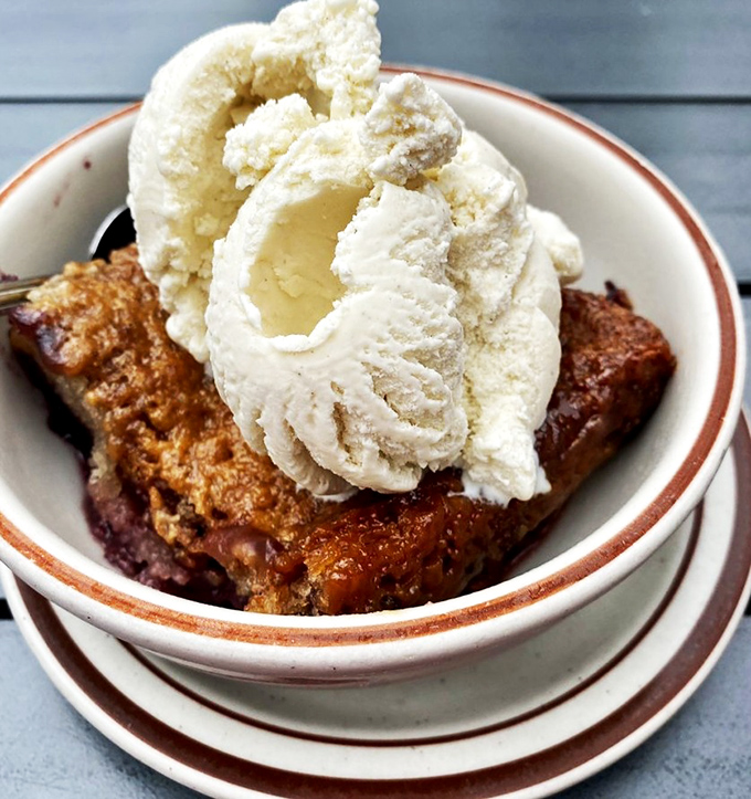 The marionberry cobbler that launches a thousand diet exceptions. With ice cream melting into warm fruit, resistance is both futile and foolish.