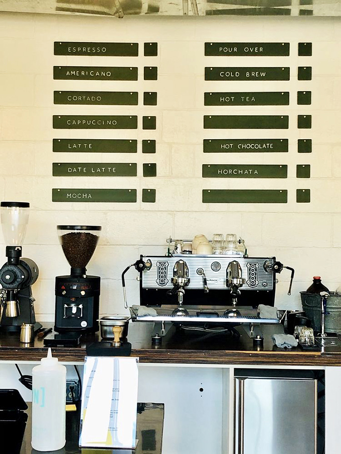 Their coffee menu board isn't just listing drinks; it's offering a geography lesson in flavor, with each option a different passport stamp.