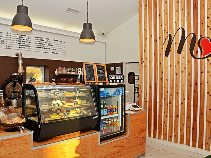 Behind every great coffee shop is a counter where magic happens. This wooden and white workspace is where Tennessee mornings get their upgrade.