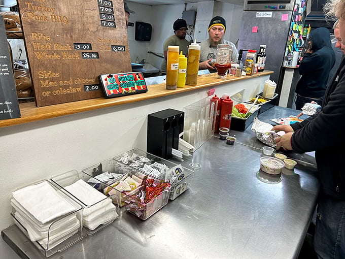 The counter area—where barbecue dreams come true and strangers become friends united by the universal language of "I'll have what they're having."