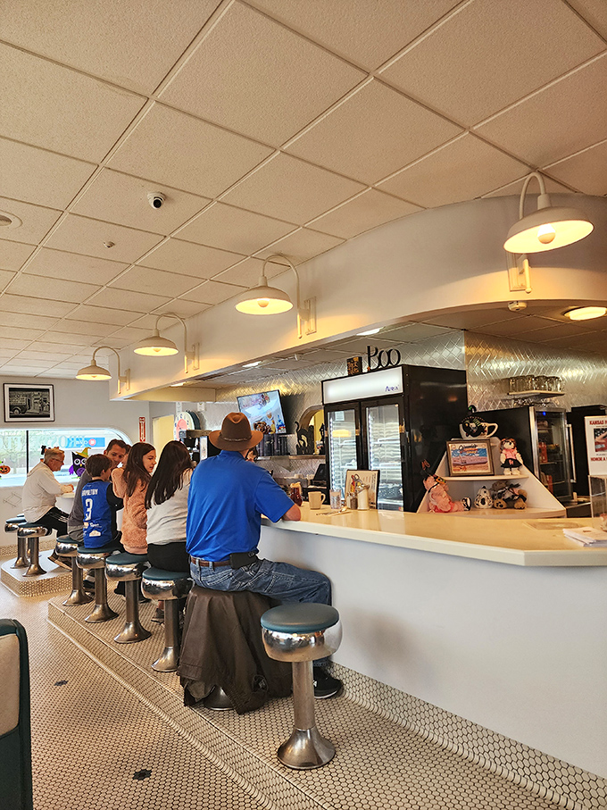 The counter where strangers become friends over coffee. These chrome stools have witnessed more life stories than a bestselling memoir.