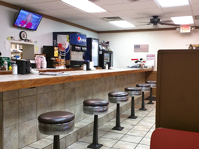 Counter seating: where solo diners become regulars, coffee flows freely, and the best local gossip is served alongside your breakfast special.