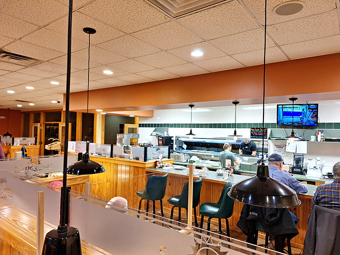 Where breakfast dreams come true: the open kitchen at Sunny Street, where coffee flows freely and pancakes perform their golden-brown magic act.