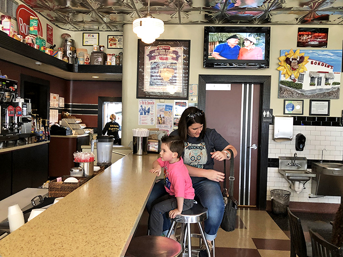 The real magic happens at this counter, where generations have learned the important life skill of balancing excitement with patience.