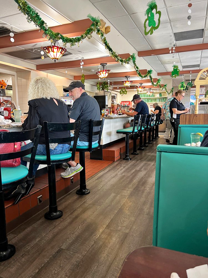 Counter dining where strangers become temporary neighbors, united by the universal language of "pass the syrup, please."