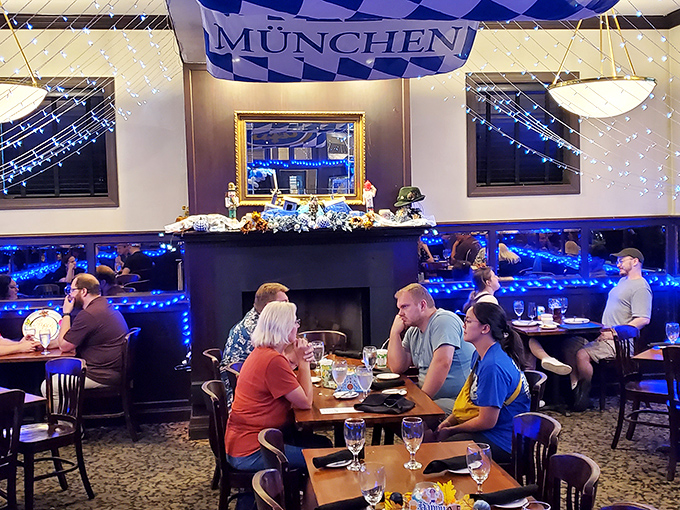 Under the glow of blue lights and Bavarian banners, strangers become friends united by the universal language of "pass the pretzel, please."