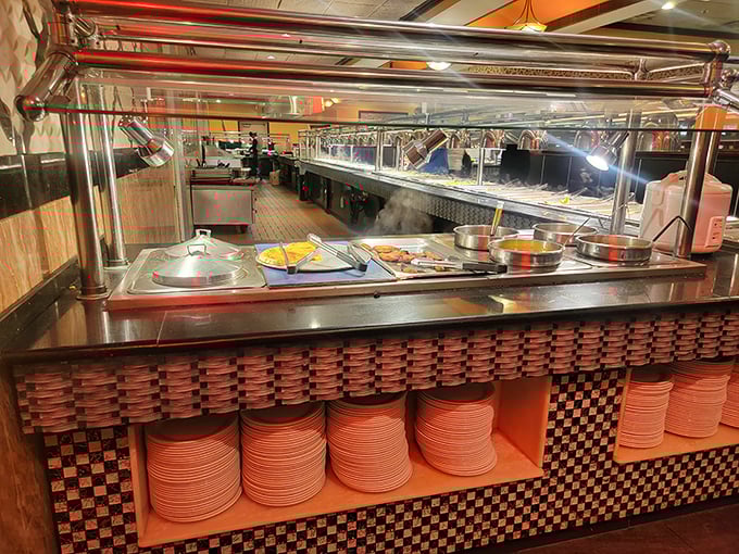 The well-stocked serving stations stand ready for hungry patrons. Those neatly stacked plates below are about to embark on journeys of delicious discovery.